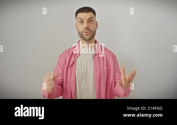 Amazed young hispanic man, mouth wide open in disbelief, stands scared ...