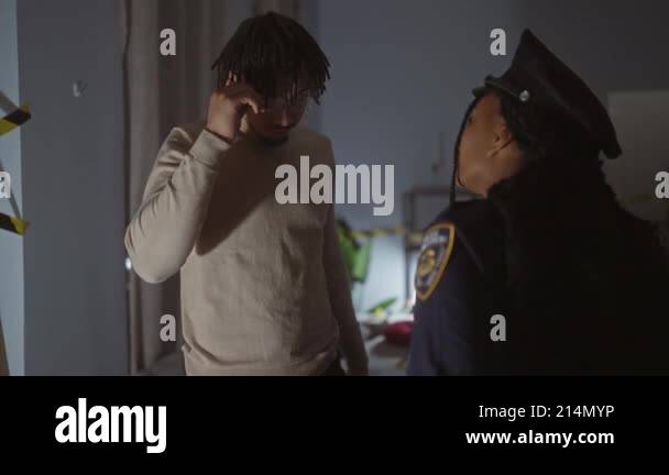 A male civilian in a tense discussion with a female police officer ...