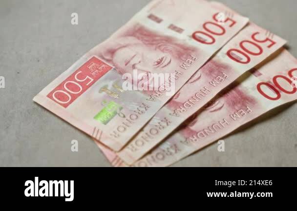 Swedish 500 krona banknotes displayed on a concrete surface ...