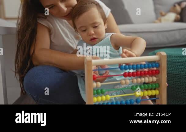 Mother and toddler using abacus in the living room with love and care Stock Video Footage - Alamy