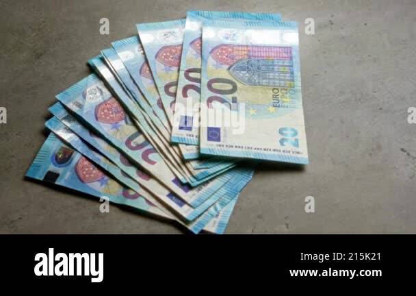 European twenty euro banknotes fanned out on a concrete surface ...