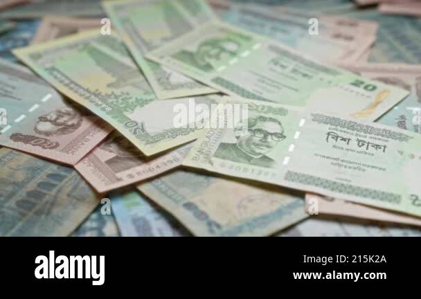 Bangladeshi banknotes scattered on a surface showcasing various ...
