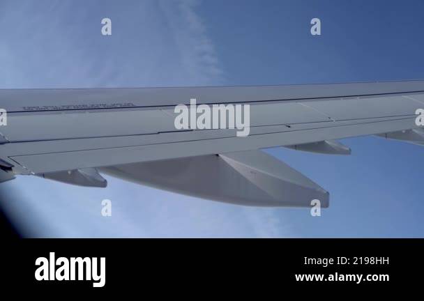 Top bird eye View from passenger porthole of beautiful landscape Flying airplane engine wing of ...