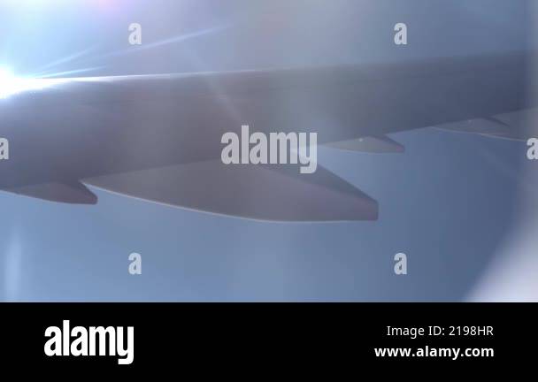 Top bird eye View from passenger porthole of beautiful landscape Flying airplane engine wing of ...