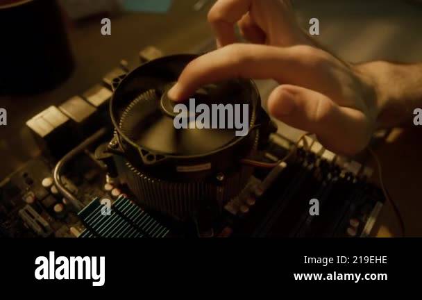 Close-up shot of unrecognizable man testing out CPU cooler on ...