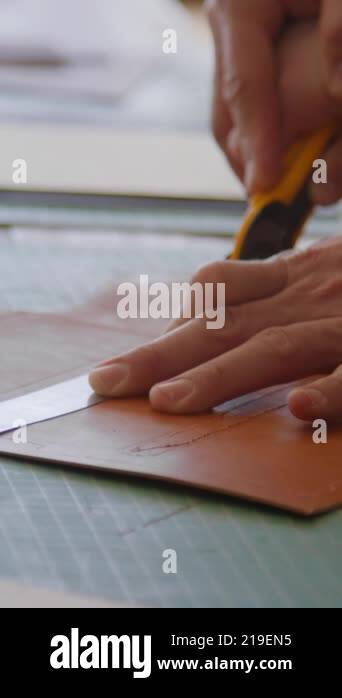 Vertical close-up shot of two unrecognizable hands working together ...