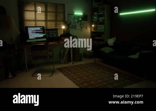 Interior of dimly lit cozy and cluttered bedroom of programmer with ...