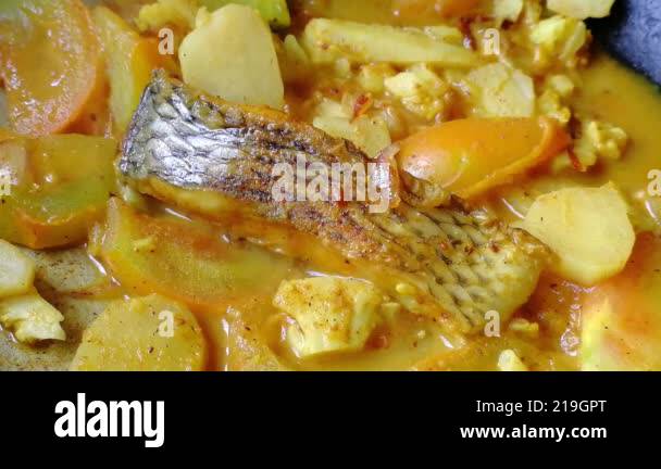 Delicious and hot fish curry. Traditional dish made with fish pieces ...