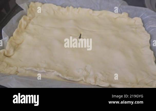 The dough on the baking sheet is filled with filling. Baking. Step-by ...