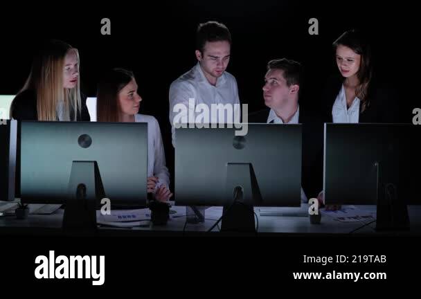 Ceo leader and team working in office. Men and women leaders team work at desks with monitors in ...