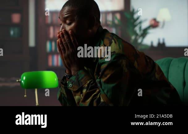 Therapist offering help to army soldier during psychotherapy session ...