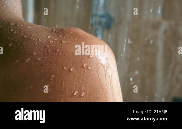 Sensual footage of pure water droplets on human shoulder. Body ...