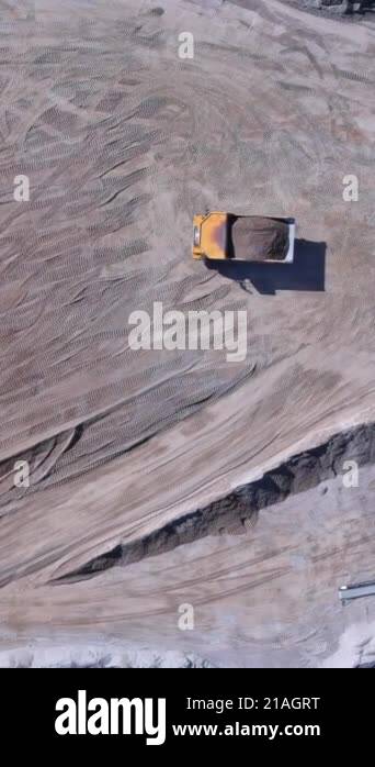 Heavy machinery works on ground, moving earth shaping at construction ...