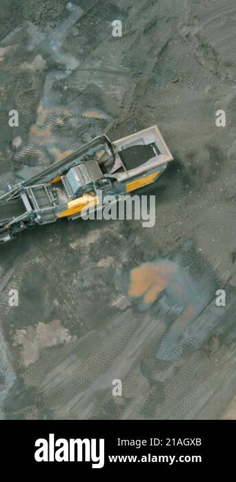 Excavators conveyor system move materials at construction site under ...