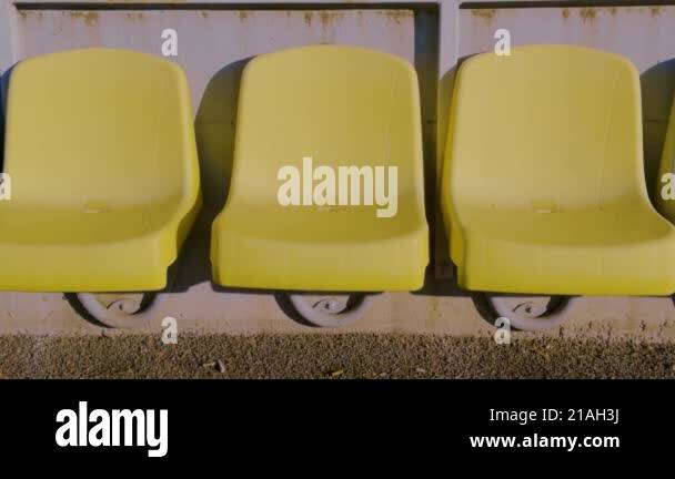 A stunning and vibrant arrangement of bright yellow stadium seats ...