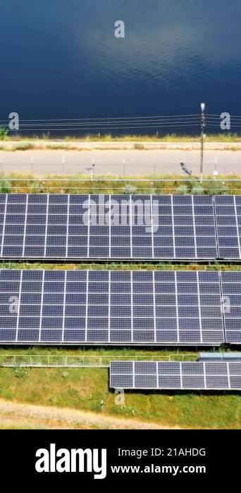 Solar panels near the road. Sunny batteries collect ecological energy ...