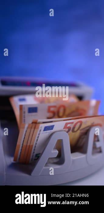 Modern cash counting machine counts fifty euro bills. Bank equipment ...