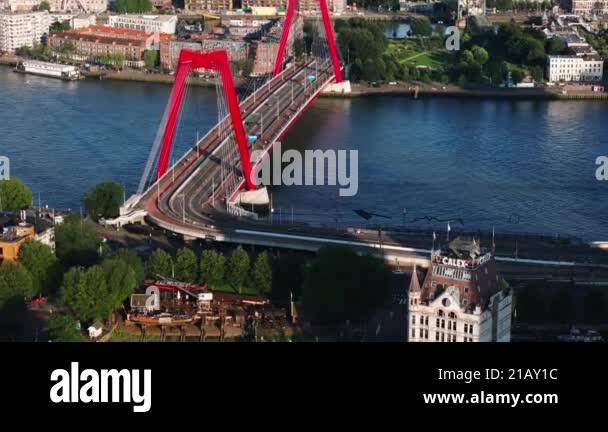Aerial view of Willemsbrug, famous red bridge over Nieuwe Maas river in ...