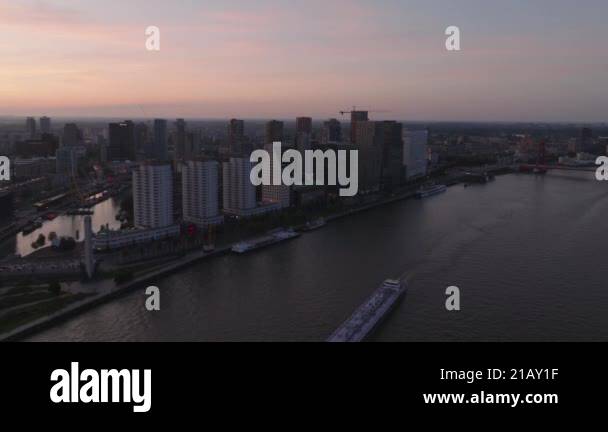 Breathtaking Rotterdam skyline at sunset, with high rise buildings ...
