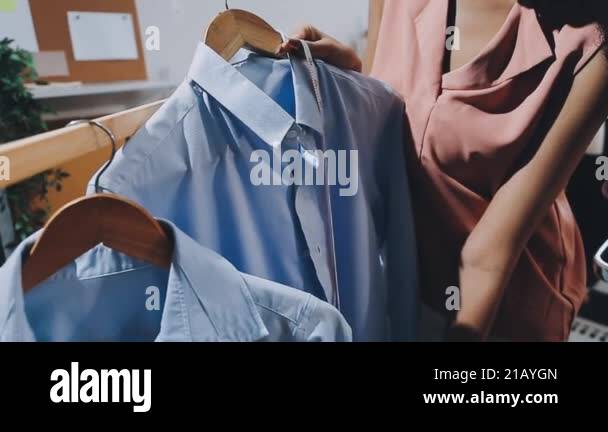 female hands choosing clothes Stock Video Footage - Alamy