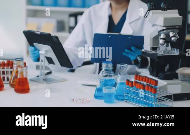 scientist working in the laboratory. scientist working on a test tube ...