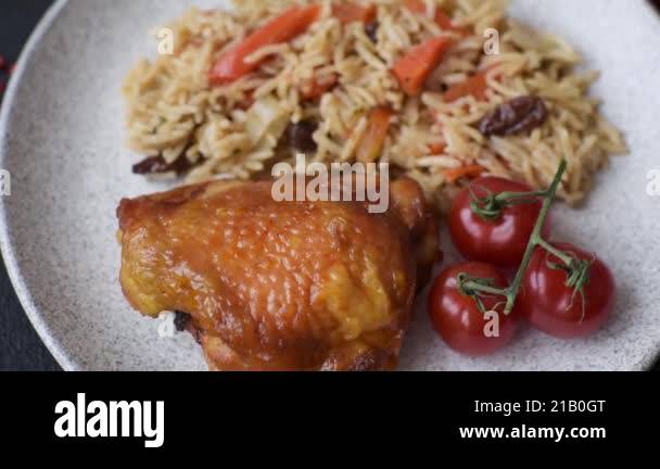 Delicious fresh pilaf with rice, carrots, meat, onions, spices and ...