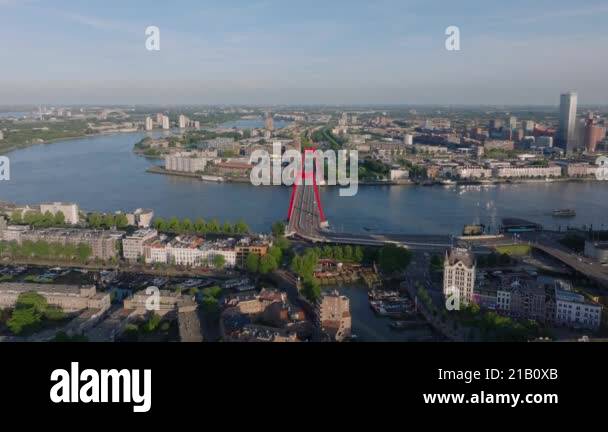 Aerial view of Rotterdams skyline featuring Willemsbrug bridge over ...