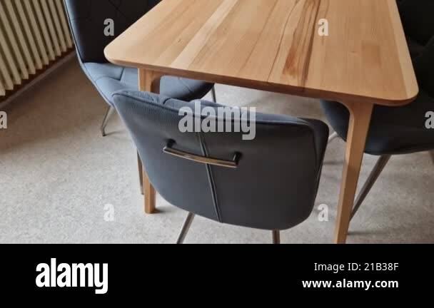 home dining table made of beech wood. around there are 8 chairs with ...