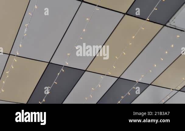 large glass shop windows with an overhang of the roof are a mirror of ...