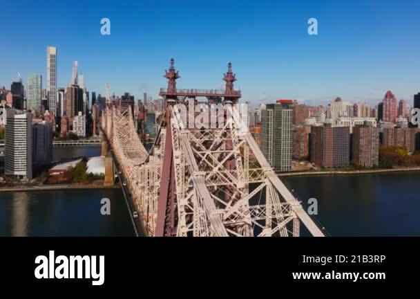 Aerial views glide over Queensboro Bridge, highlighting iconic ...