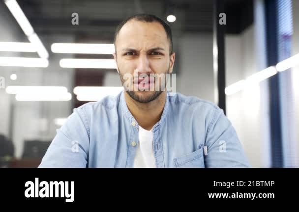 Webcam view. Frustrated stressed african american businessman reads bad ...