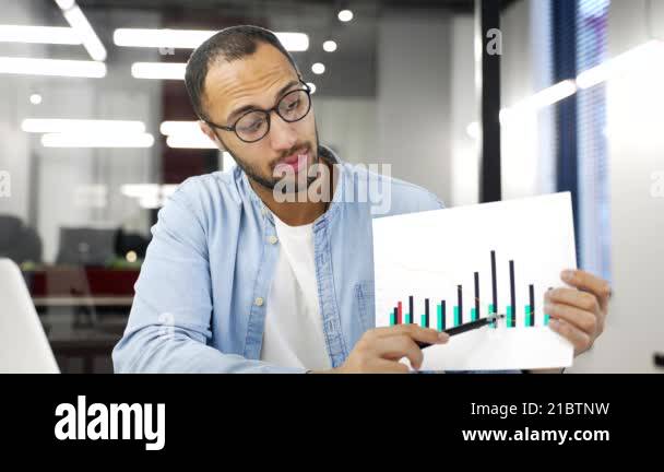 Webcam view. African american businessman conducts an online ...