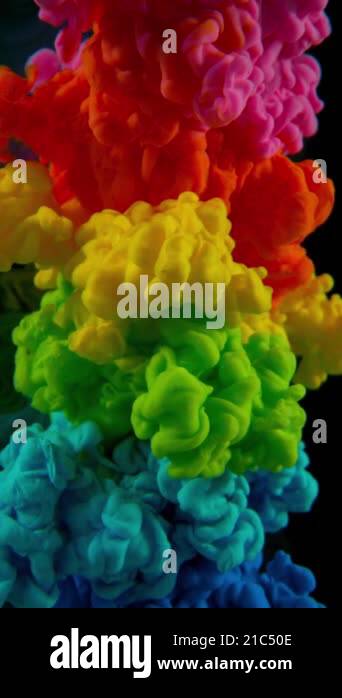 Abstract background, colorful liquid pouring isolated on black ...