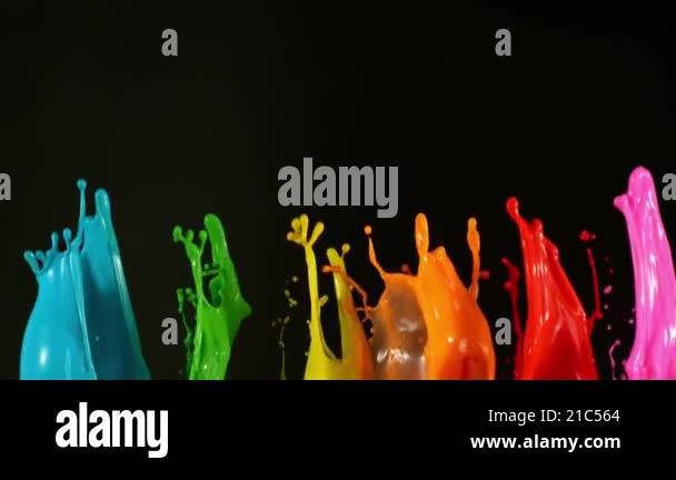Super slow motion of dancing colors shapes isolated on black background ...