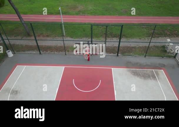 An impressive aerial shot captures a vibrant basketball court, showcasing its colorful design ...
