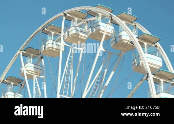 Ferris wheel features spacious, white gondolas and provides a stunning ...