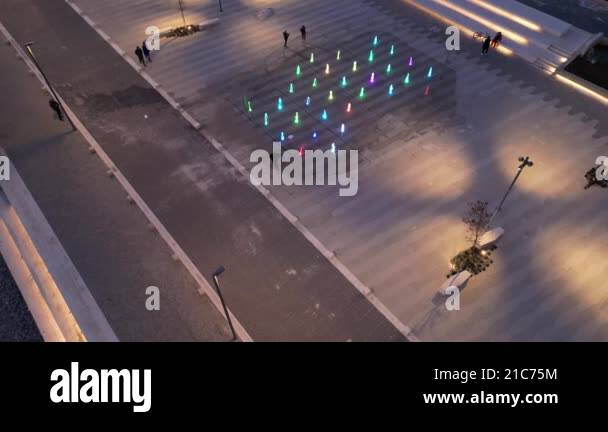 A lively and vibrant outdoor scene that showcases illuminated light ...