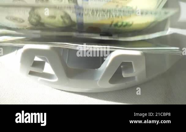Cash money inside running banknotes counter. Banking and financial ...