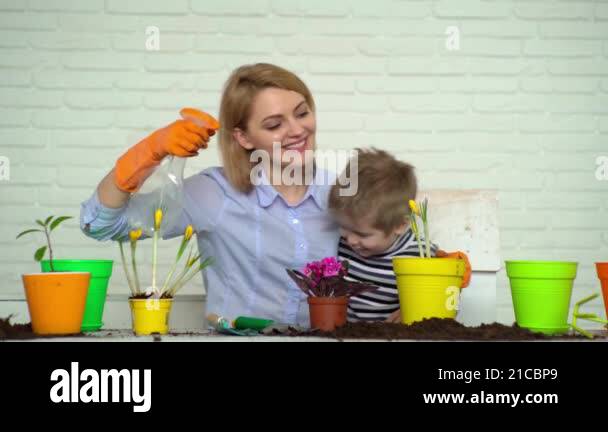 Mother and child planting together. Spring and hobbies, family grows ...