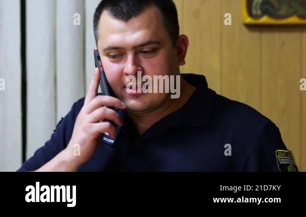Male firefighter chief have serious telephone conversation with his ...