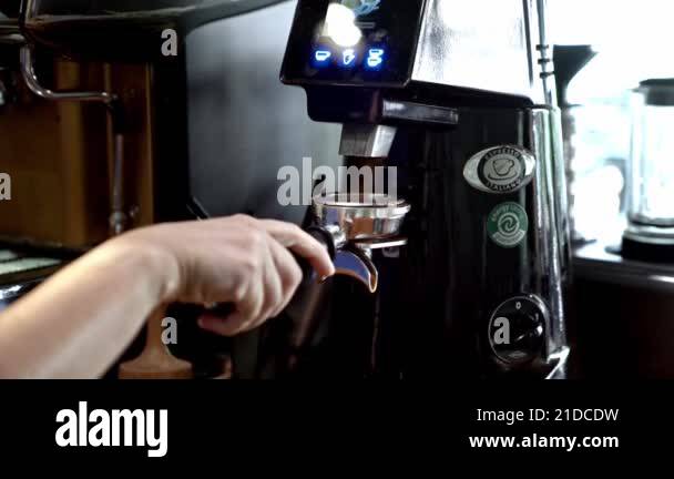 Coffee preparation process with barista using coffee grinder and ...