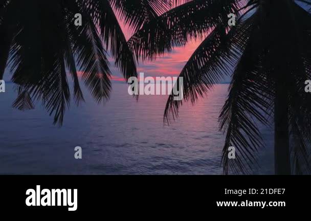 Romantic time after sunset by sea. Cinematic aerial video camera moves ...