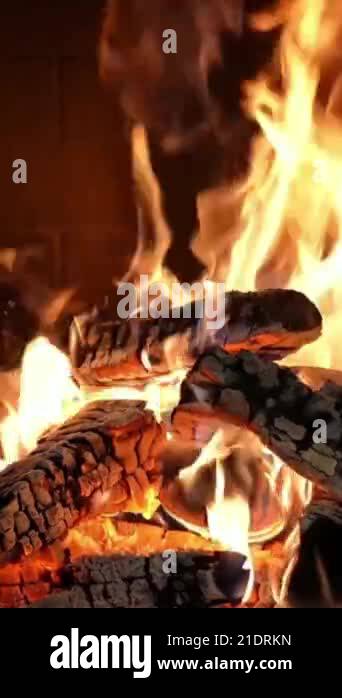 Burning log fire in a fireplace Stock Video Footage - Alamy