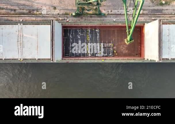 General cargo ship is loaded with metal pipes. Pipes for gas and oil ...