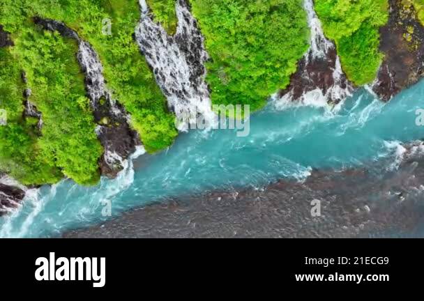 Waterfall in Iceland, Cold turquoise glacial river with many streams in ...