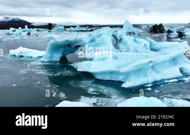 Iceberg in the ocean, Huge Chunks of Blue Glacier Ice floating on the ...