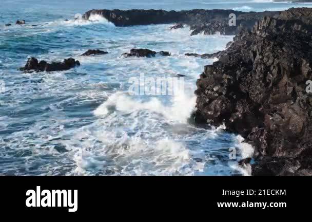 Extreme huge waves crash on the shore, Rocky ocean coast in Iceland ...