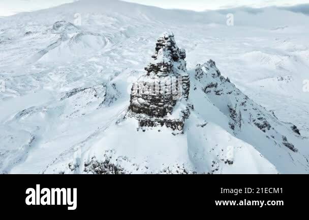 The steep peaks are covered in ice and snow, and the valleys are ...