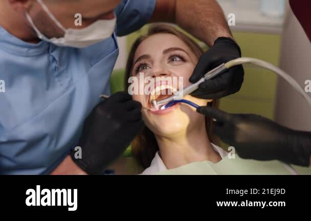 Dental tools, Dental visit, Oral care. Patient smiles as dentist and ...