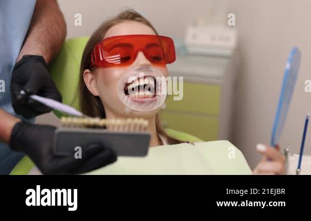 Hand mirror, Dental inspection, Dental treatment. While patient holds ...